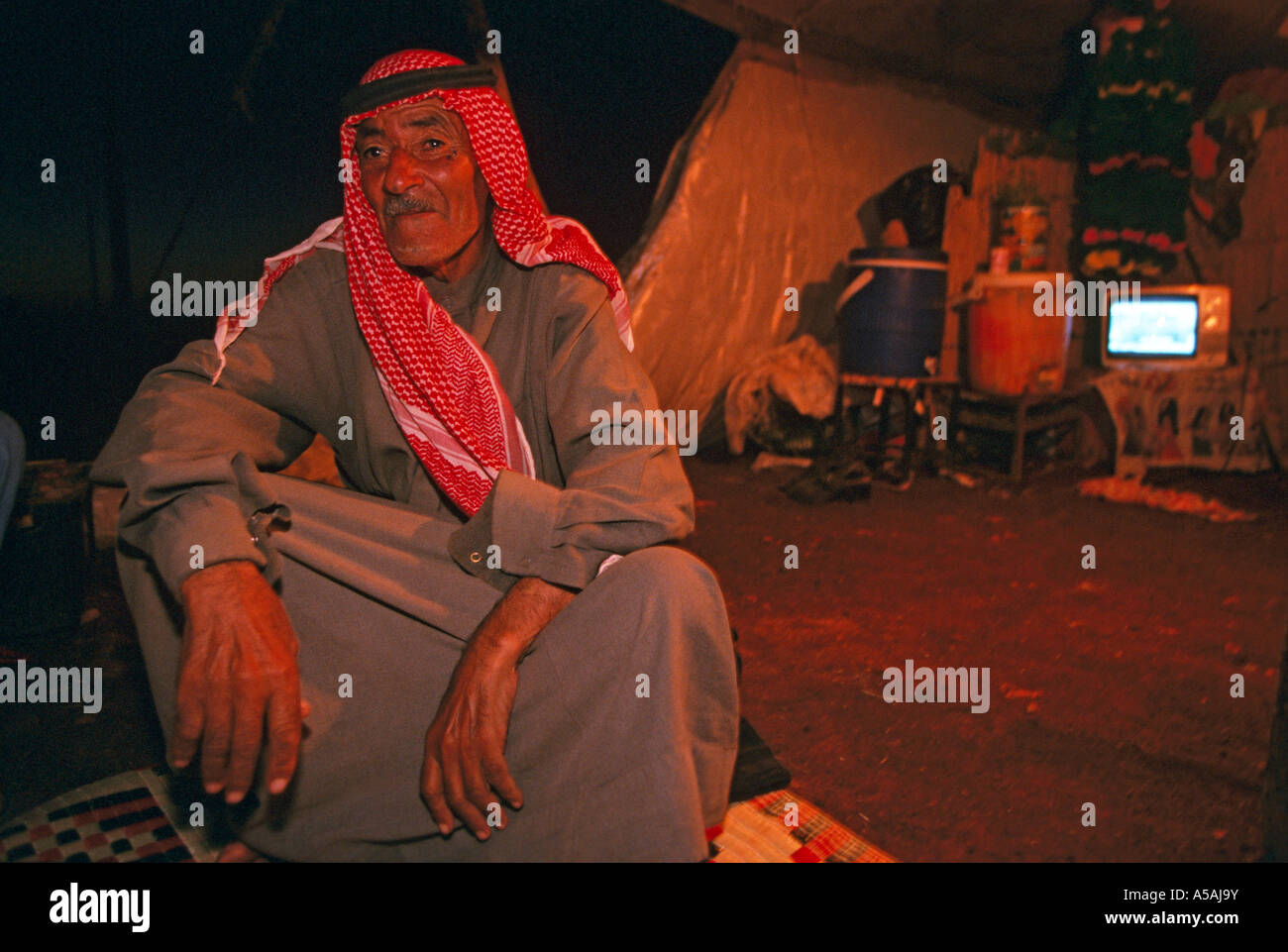 Man sitting on cot in hi-res stock photography and images - Alamy