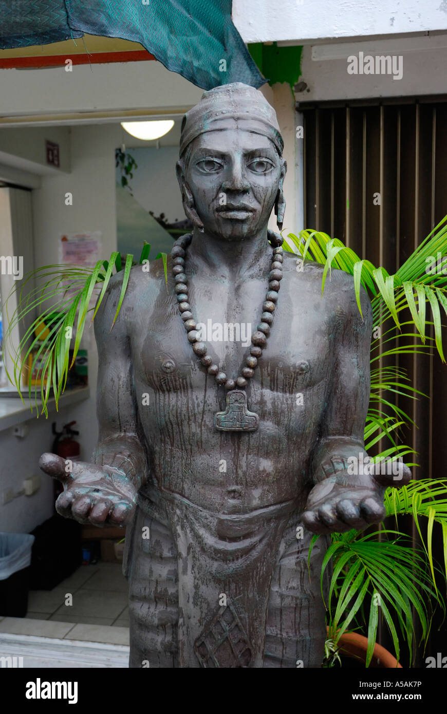 Mayan statue outside a shop on 5th Avenue the major pedestrian street ...