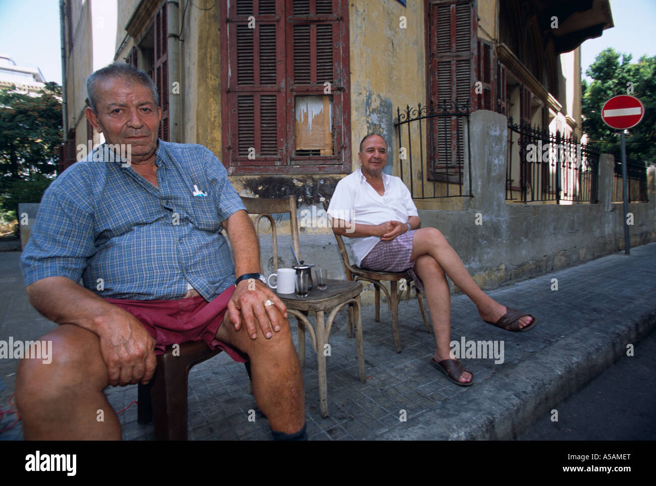 Two elderly men sitting on the pavement in Beirut Lebanon Stock Photo ...
