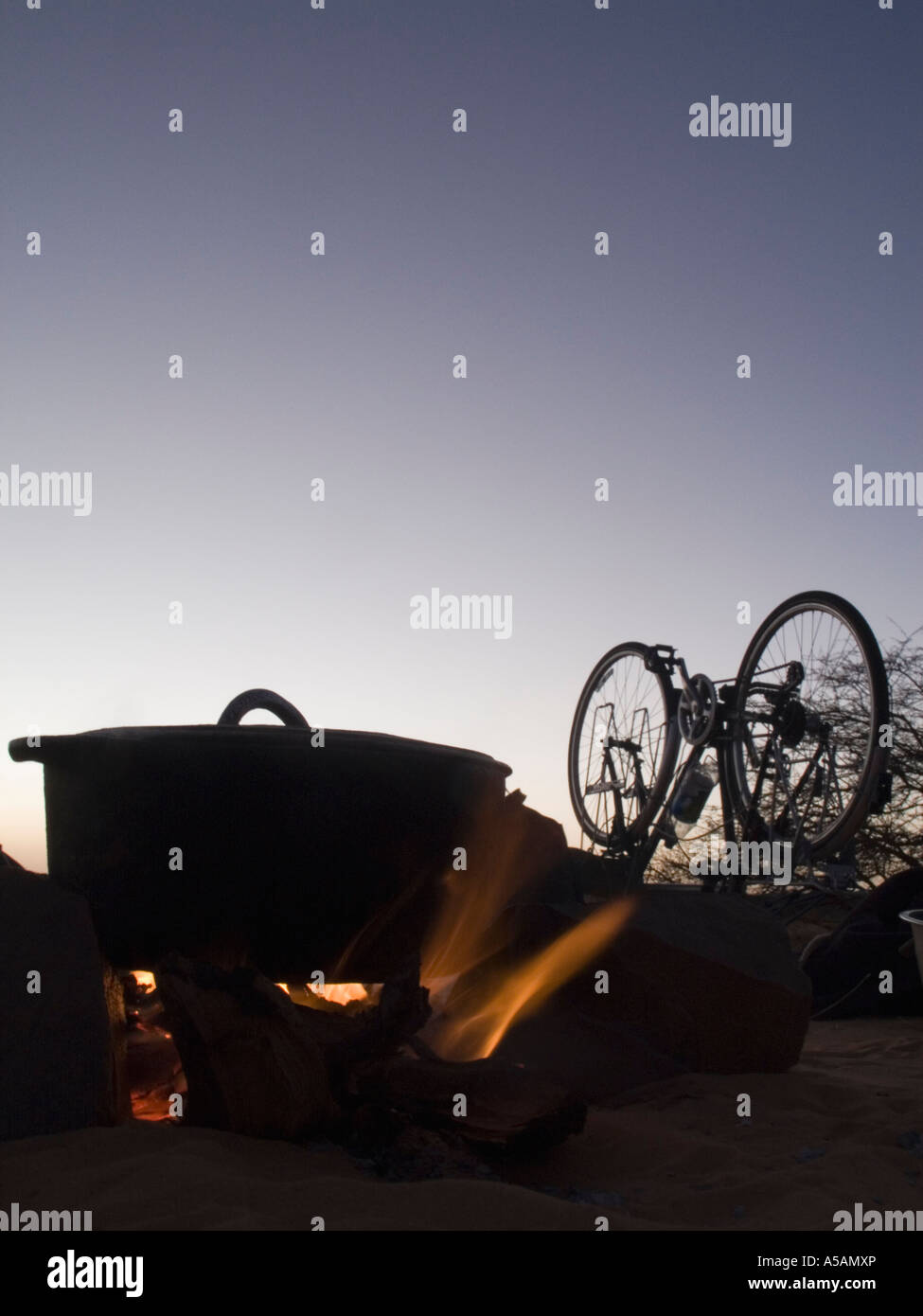 cooking after a long days travelling by bike Stock Photo - Alamy