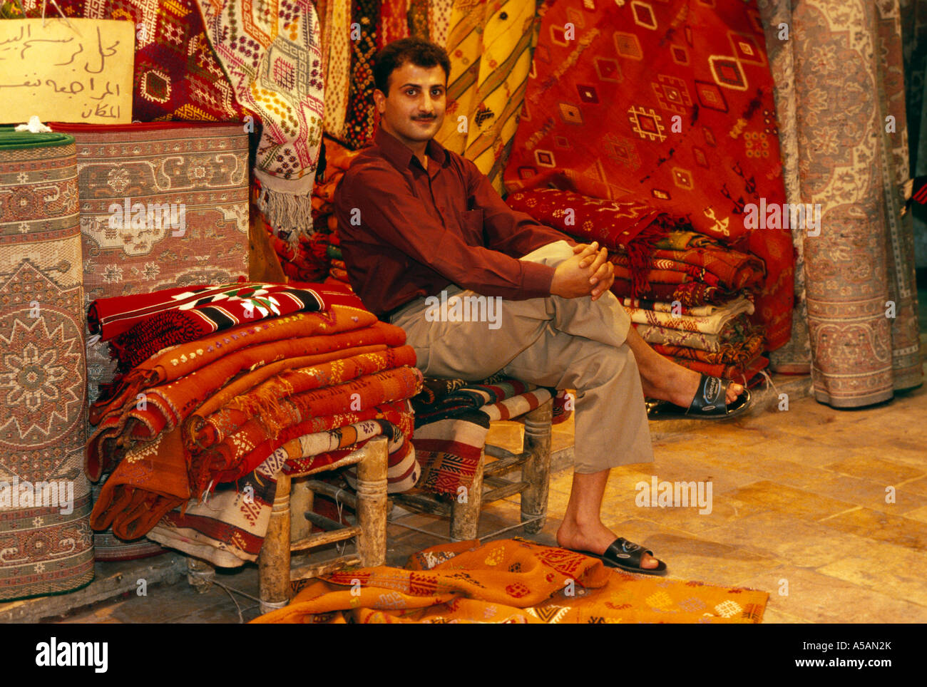Vendor selling carpets in shop, Aleppo, Syria Stock Photo - Alamy