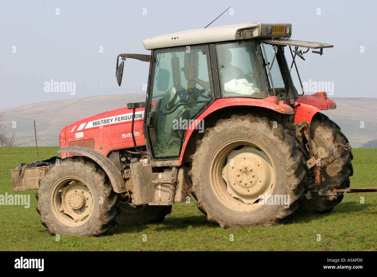 red Massey Ferguson (MF) tractor in grass field Stock Photo - Alamy