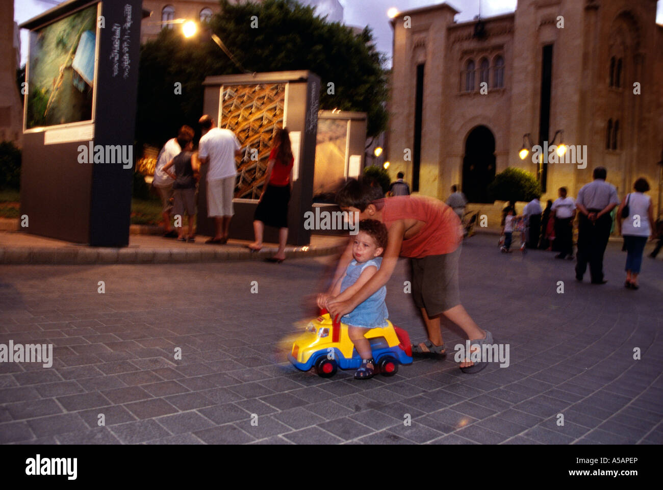 Children playing next to the displays on the street in Beirut Lebanon ...