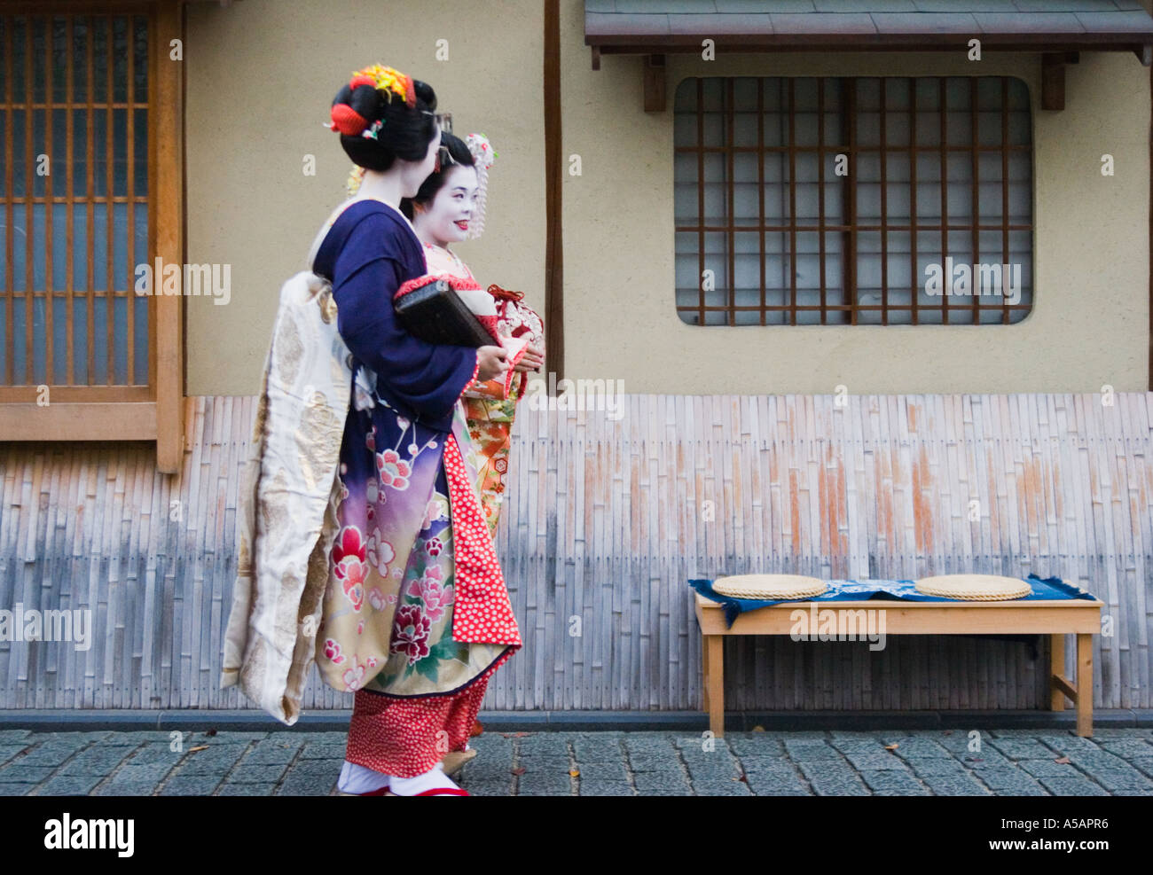 Two women dressed as Maiko / Geisha walking in the historic Higashiyama ...