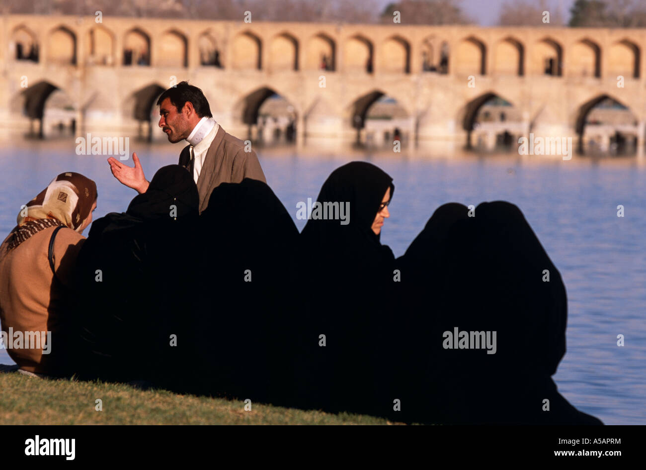 People sitting beside river, Esfahan, Iran Stock Photo - Alamy