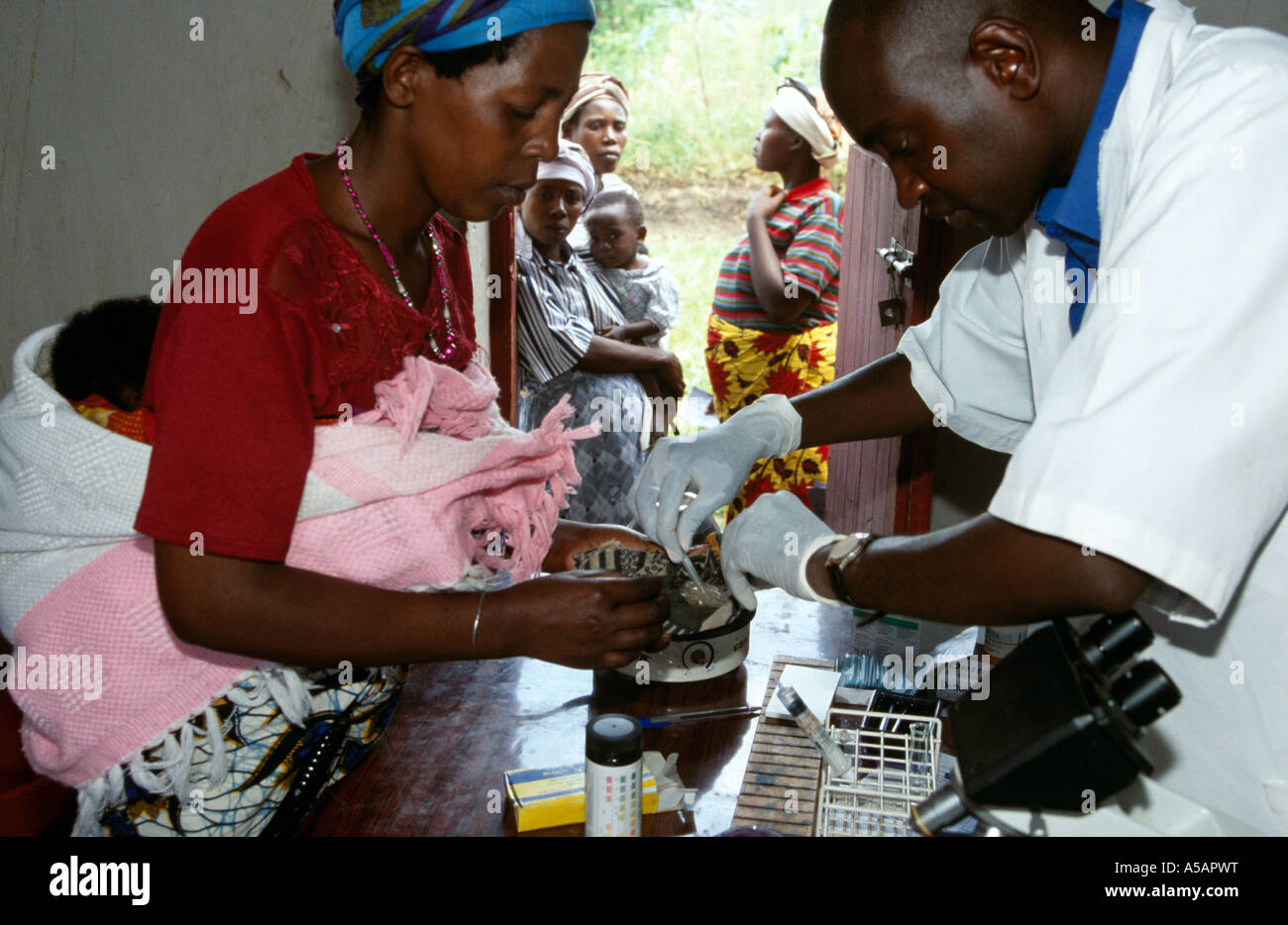 Doctors treating patients at a health care clinic Uganda Stock Photo ...