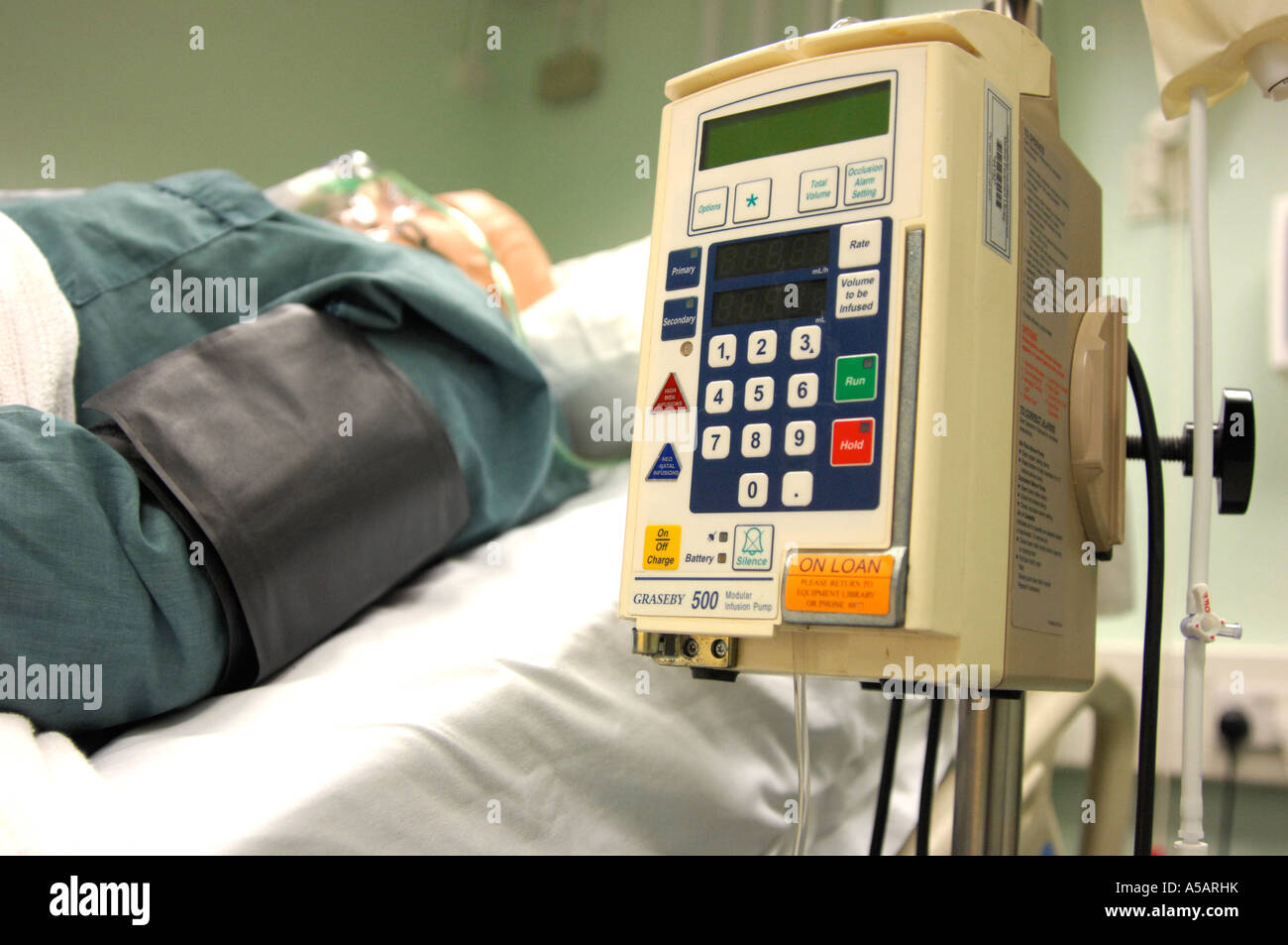 Royalty free photograph of British heart attack patient with monitor ...