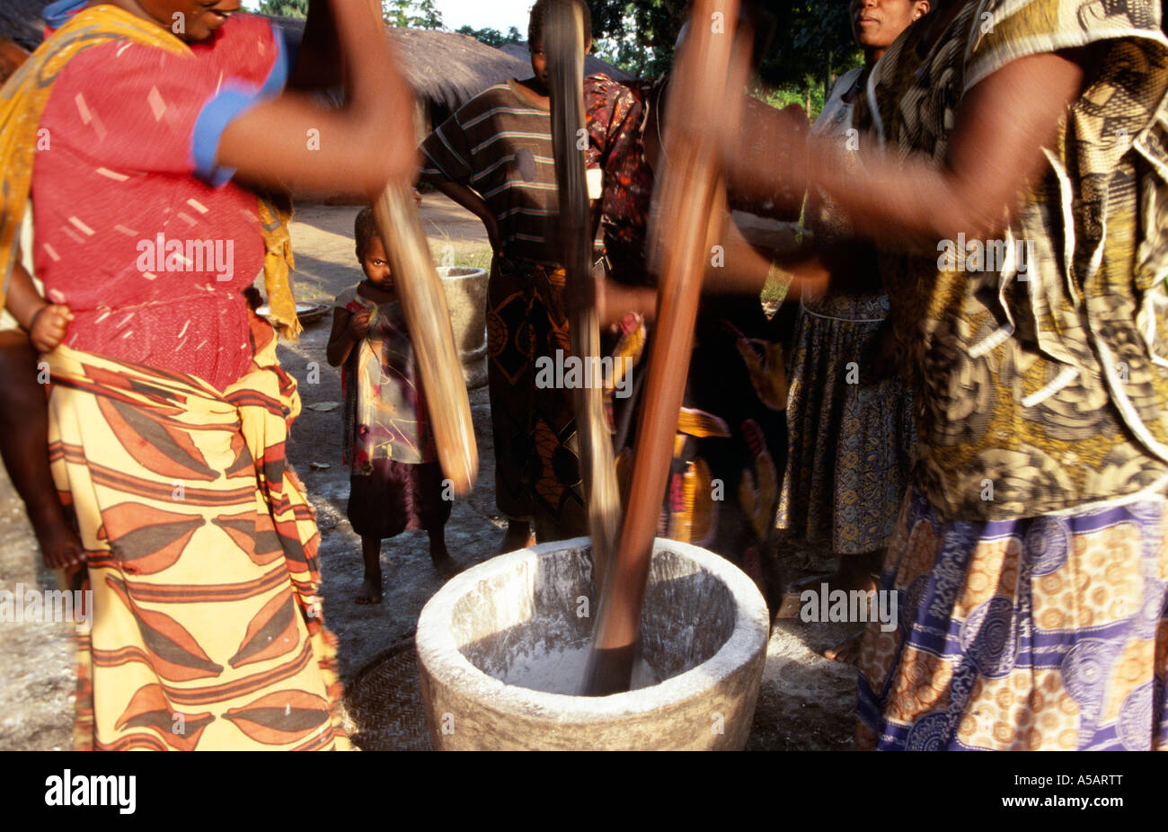 Women grinding in Uganda Africa Stock Photo - Alamy
