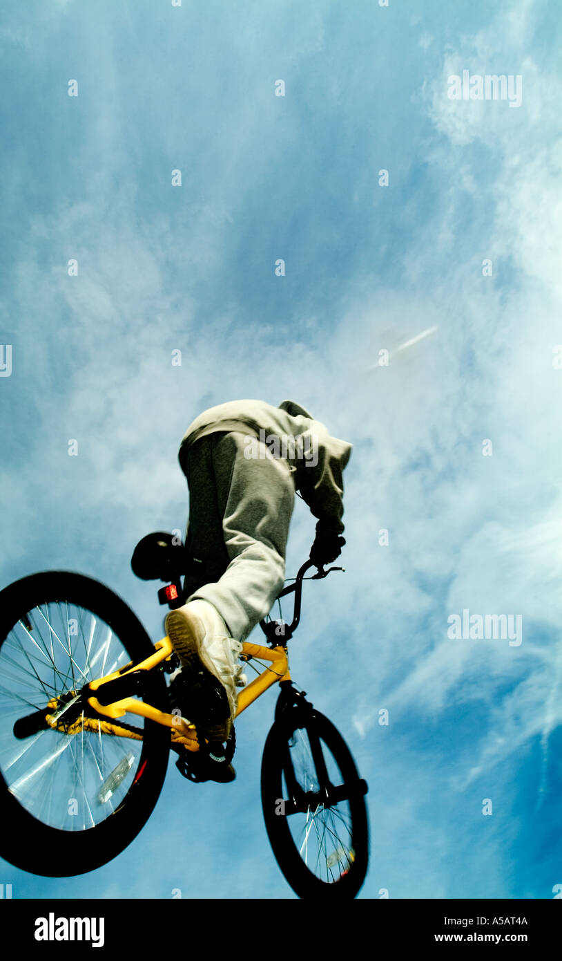Man riding a bike shot from a low angle of view Stock Photo - Alamy