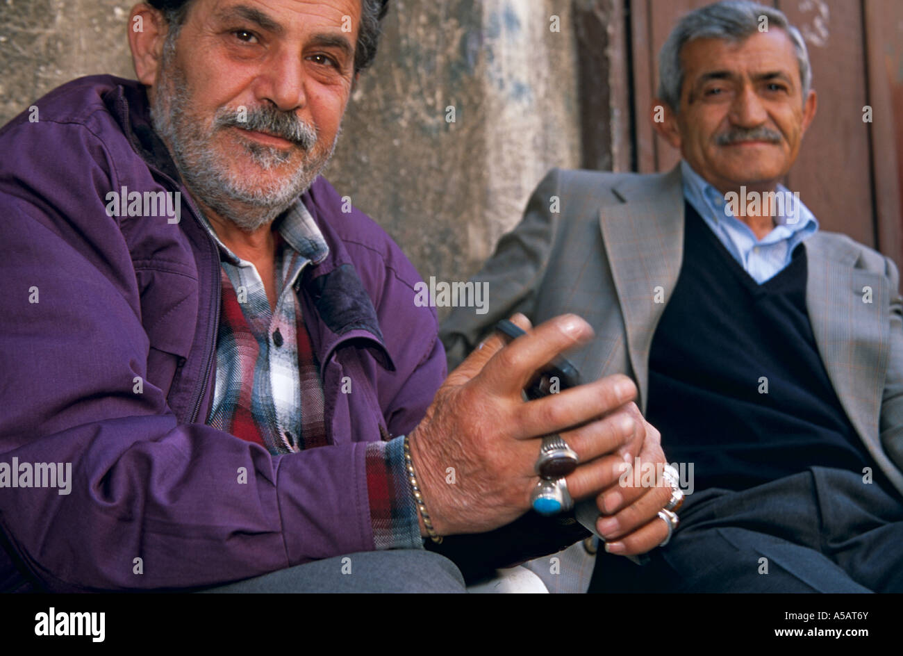 Men sitting outside thieir house Beirut Stock Photo - Alamy