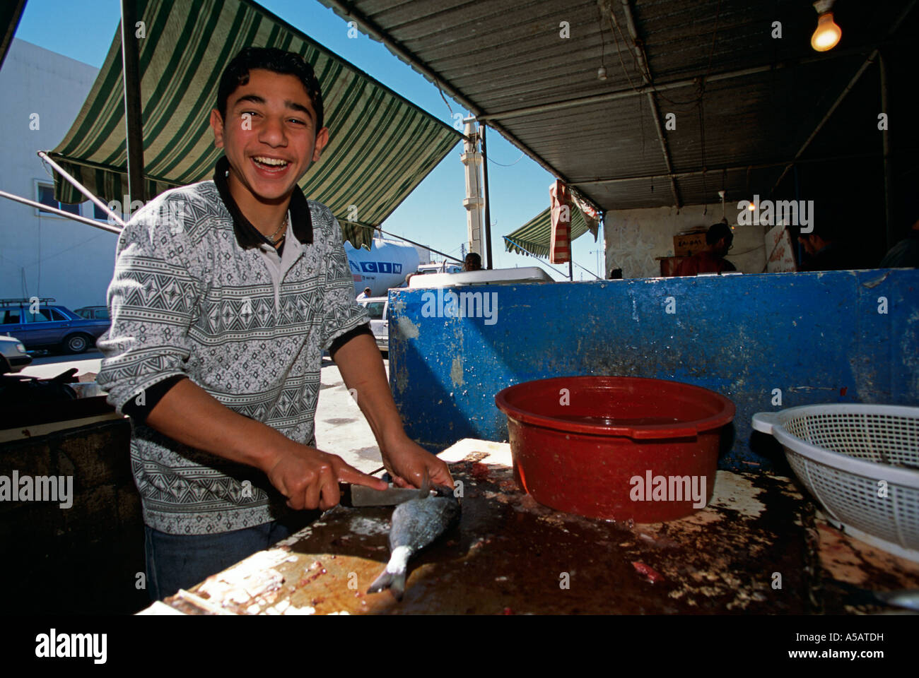 A man cutting fish Beirut Stock Photo - Alamy