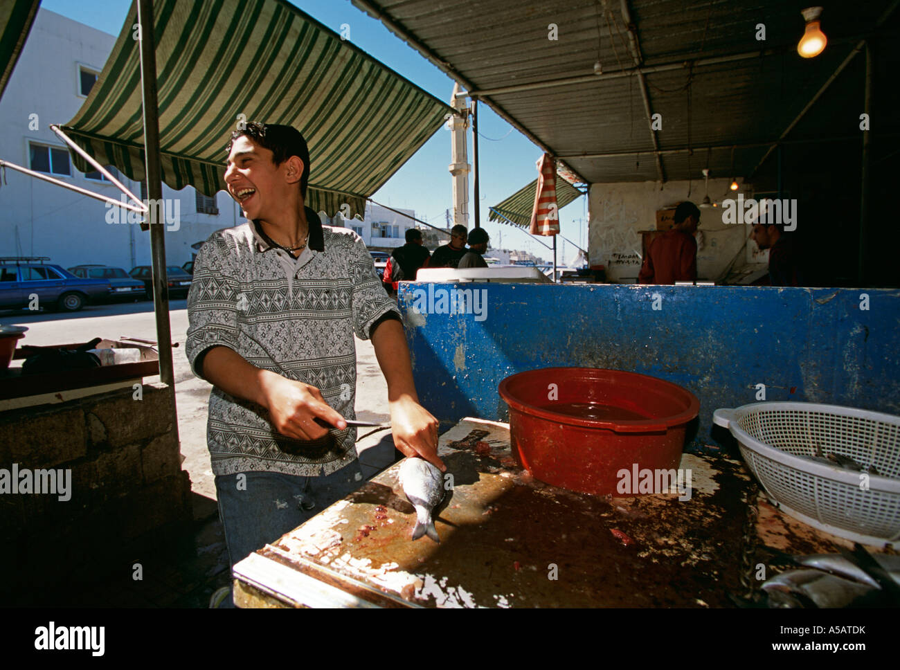 A man cutting fish Beirut Stock Photo - Alamy
