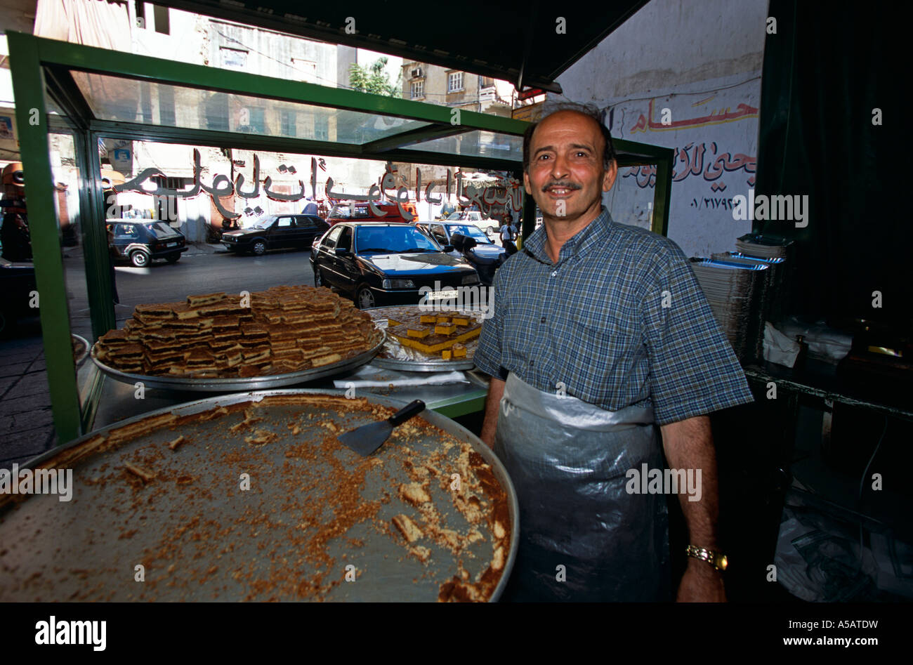 A man standing at his sweet shop Beirut Stock Photo - Alamy