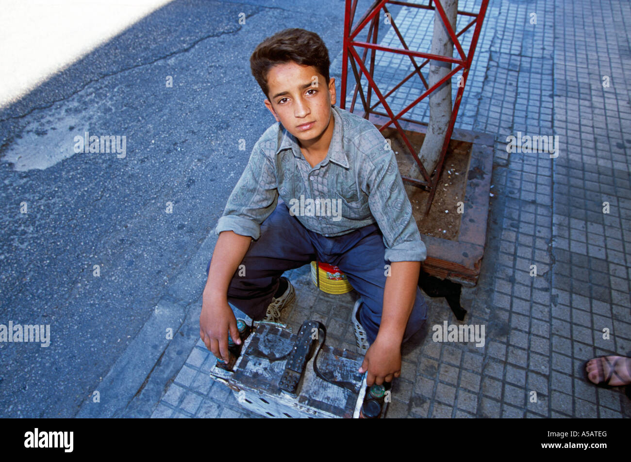 Shoeshine boy on pavement, Beirut, Lebanon Stock Photo - Alamy