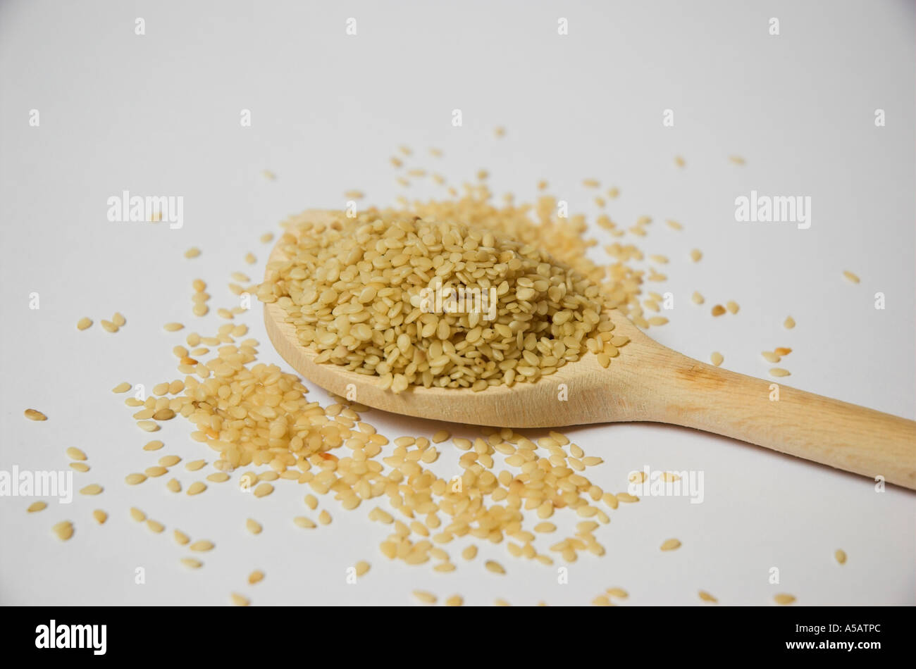 Sesame seed with wooden spoon Stock Photo - Alamy