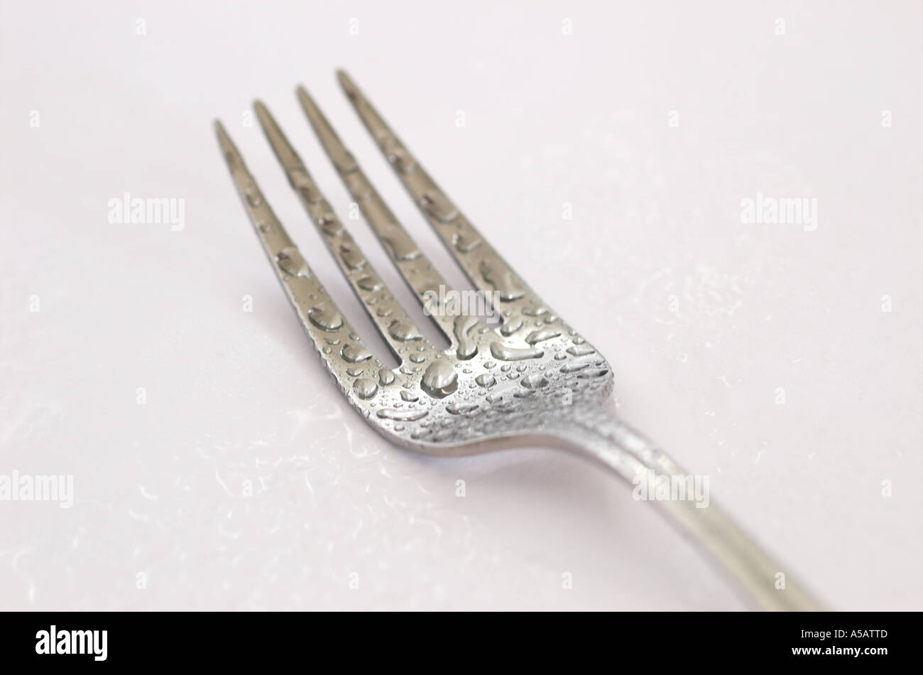 Fork close up view with water droplets Stock Photo - Alamy