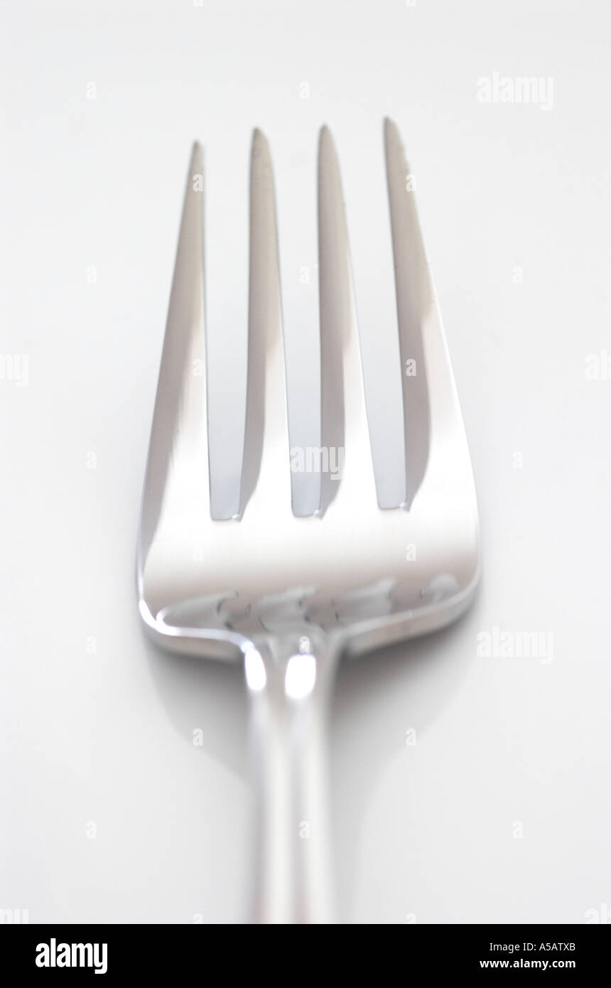 Fork on white background Stock Photo - Alamy