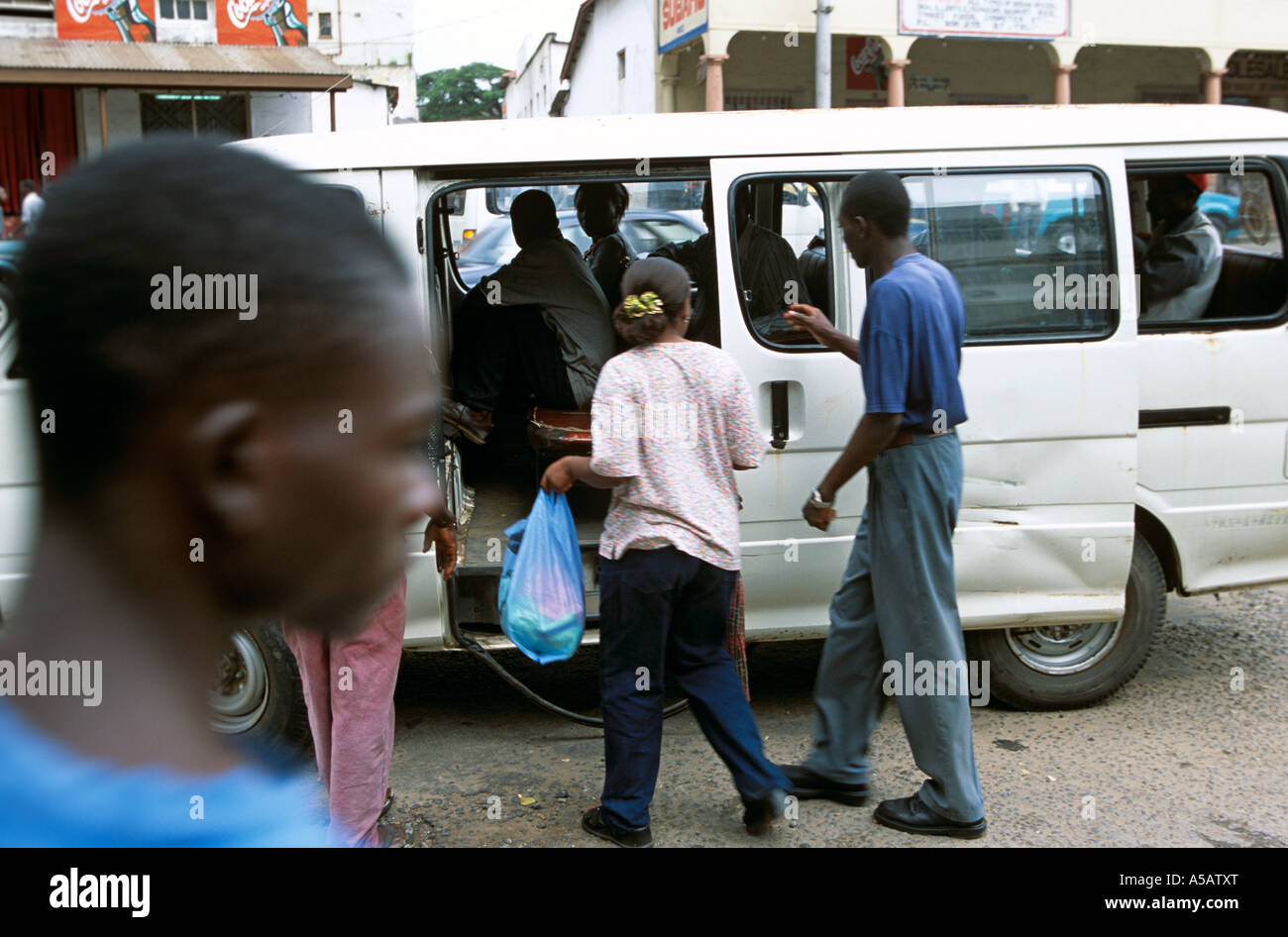 People getting into a van Malawi Stock Photo - Alamy