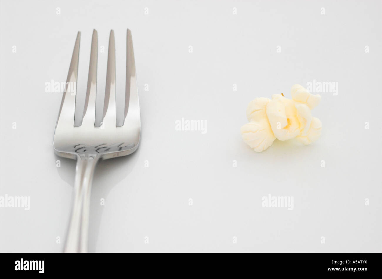 Fork and popcorn Stock Photo - Alamy