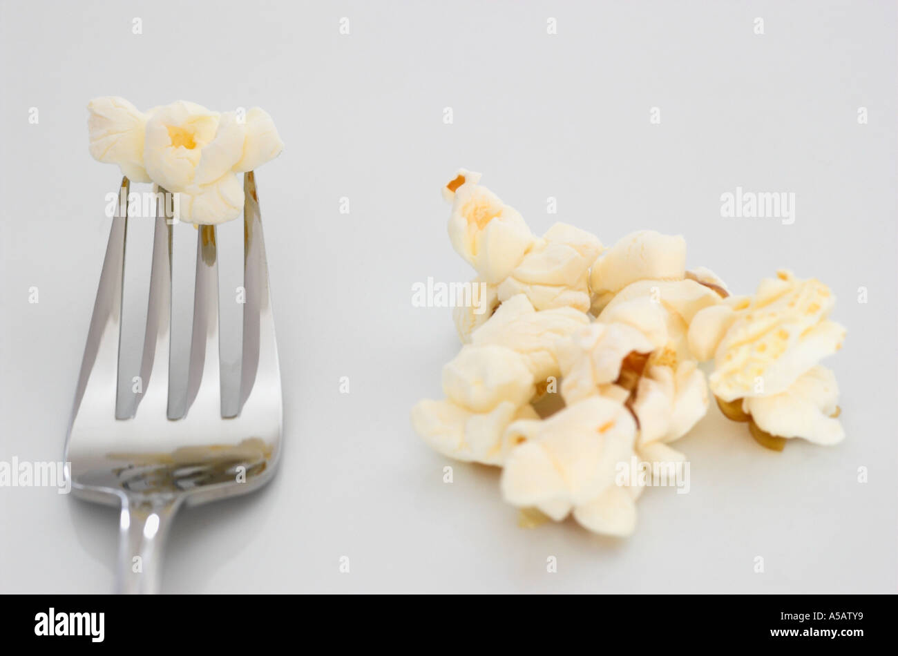 Fork and popcorn Stock Photo - Alamy