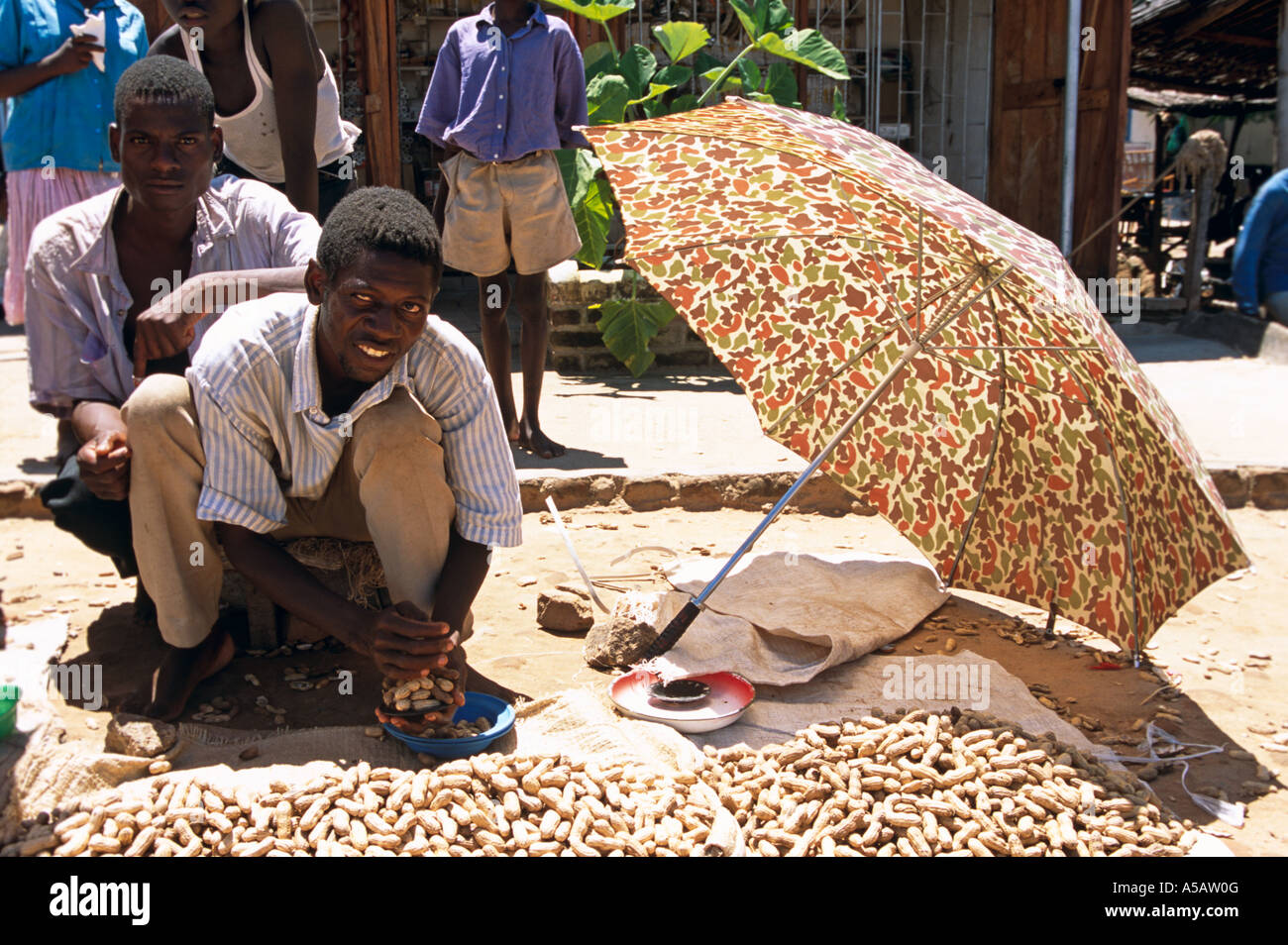 Man selling groundnuts on roadside, Malawi, Africa Stock Photo - Alamy