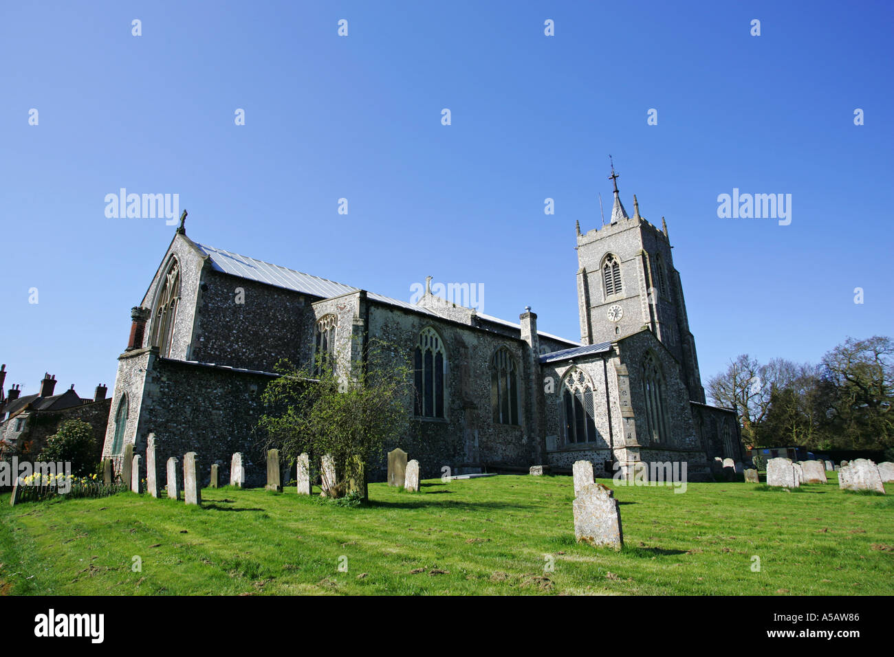 Typical Norman designed British English parish church with lush green ...