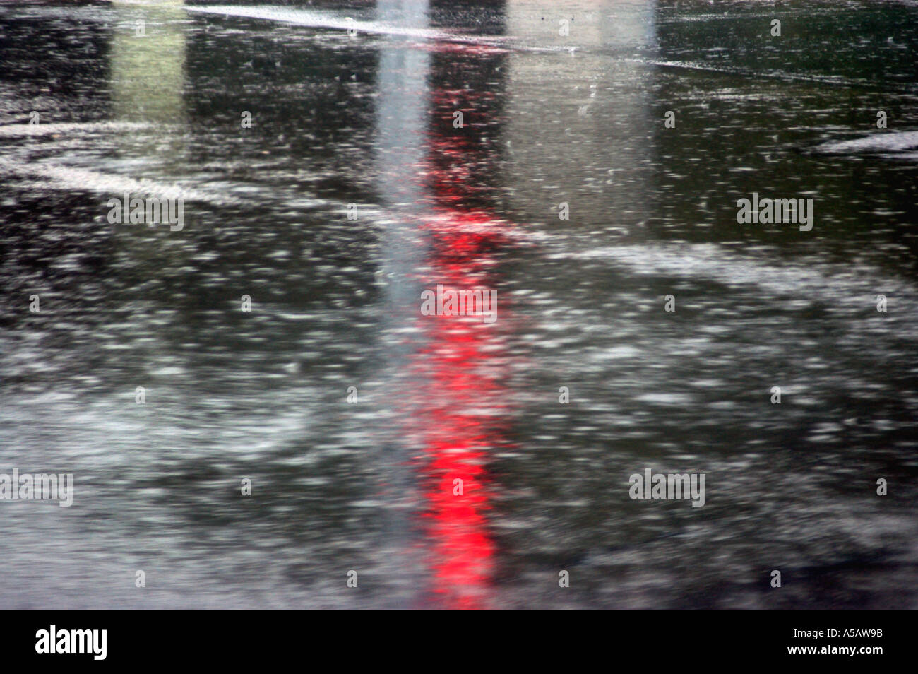 stop light reflection on rainy street Stock Photo - Alamy