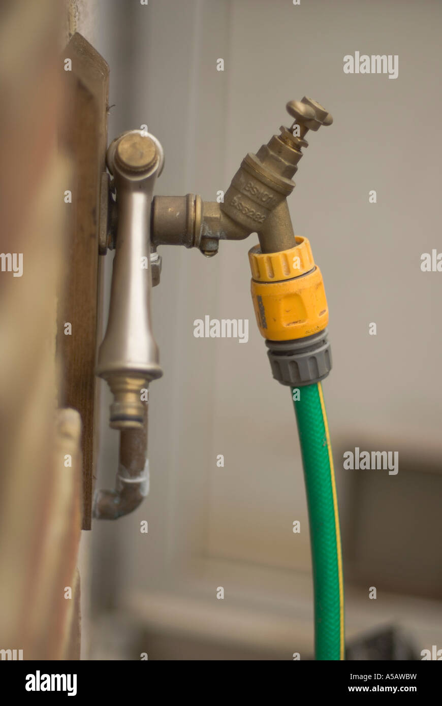 hosepipe connected to a tap Stock Photo - Alamy