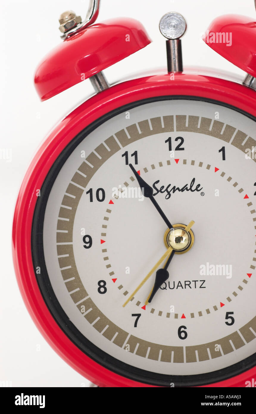 Alarm clock showing five to seven Stock Photo - Alamy