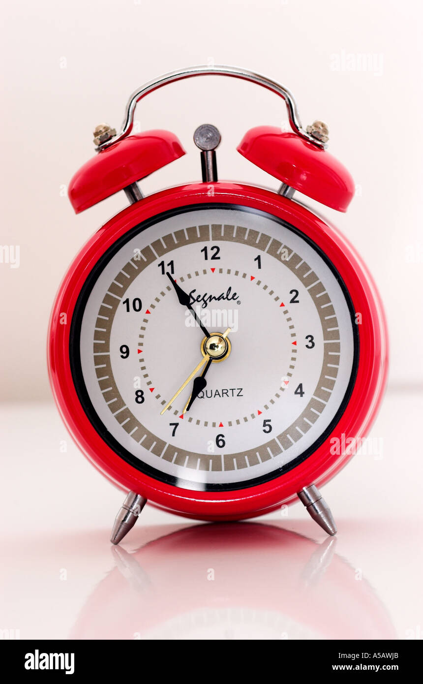 Alarm clock showing five to seven Stock Photo - Alamy