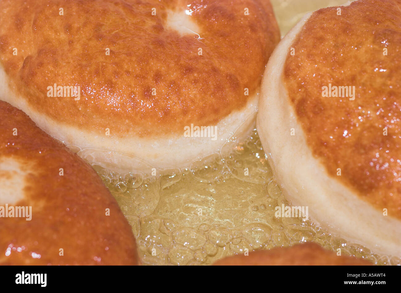 Doughnuts being deep fried Stock Photo - Alamy