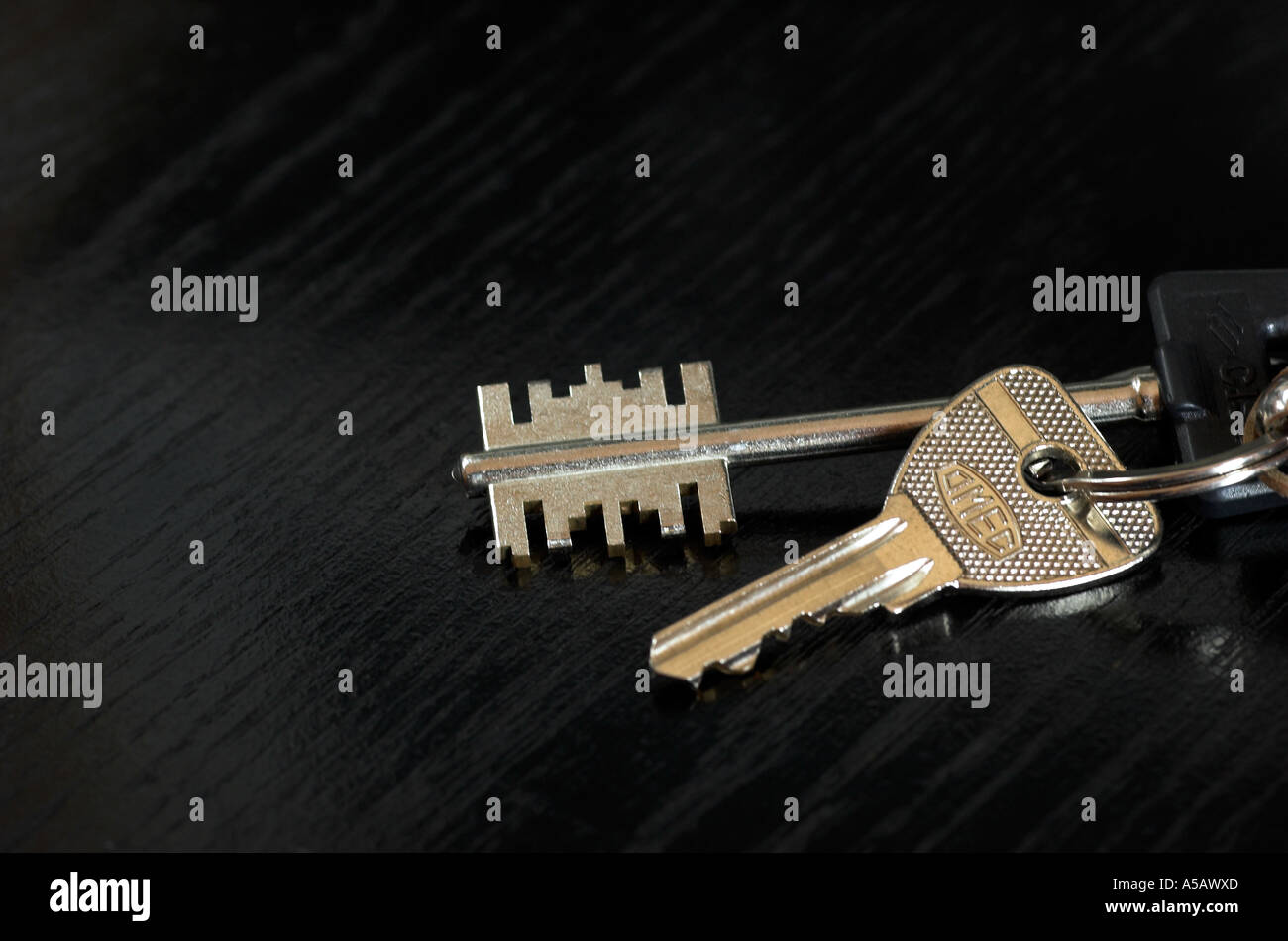 Two keys on black background Stock Photo - Alamy