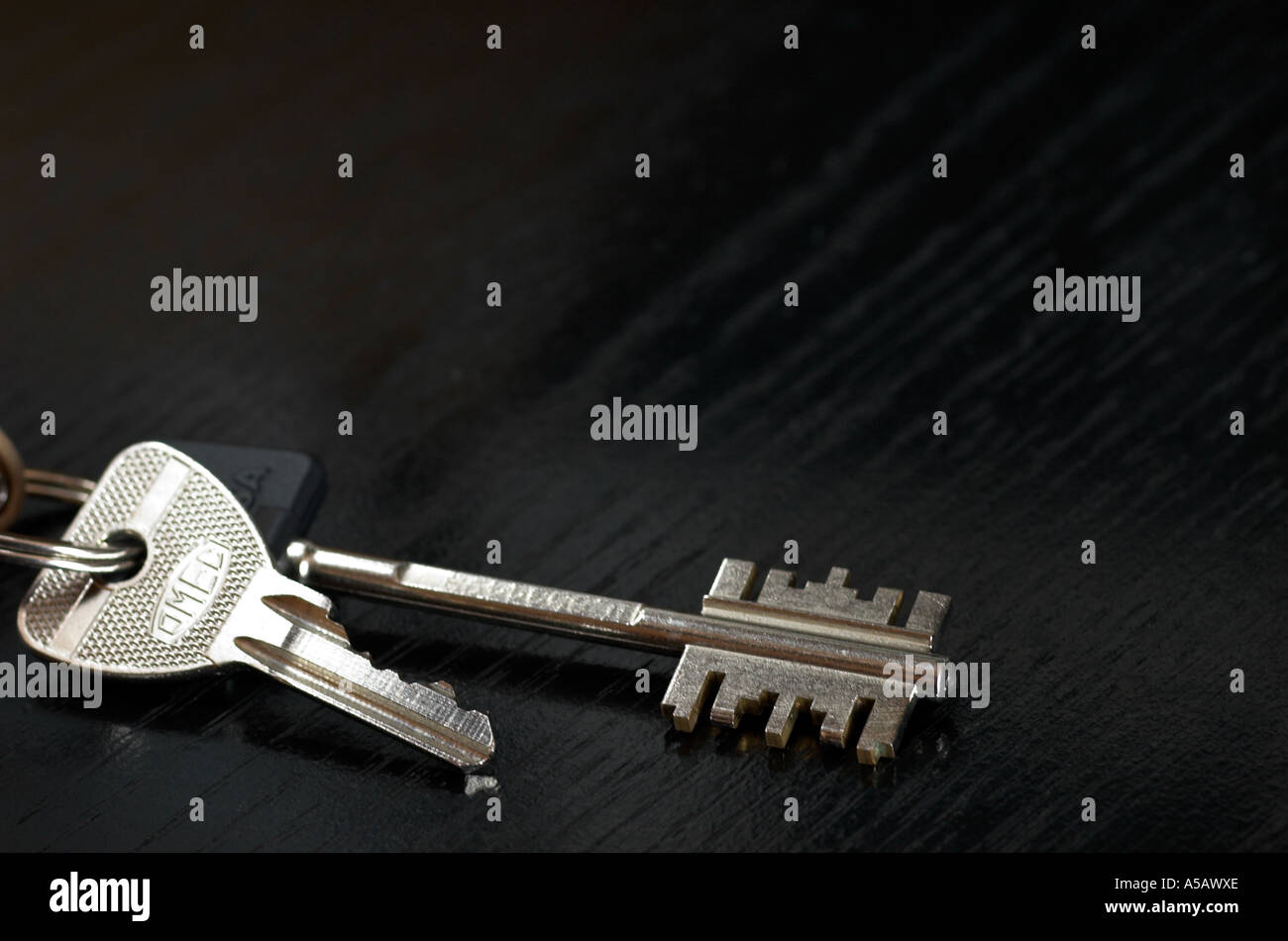 Two keys on black background Stock Photo - Alamy