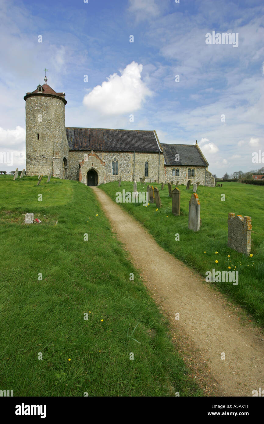 Pathway leads up to a typical Norman Church in Norfolk East Anglia ...