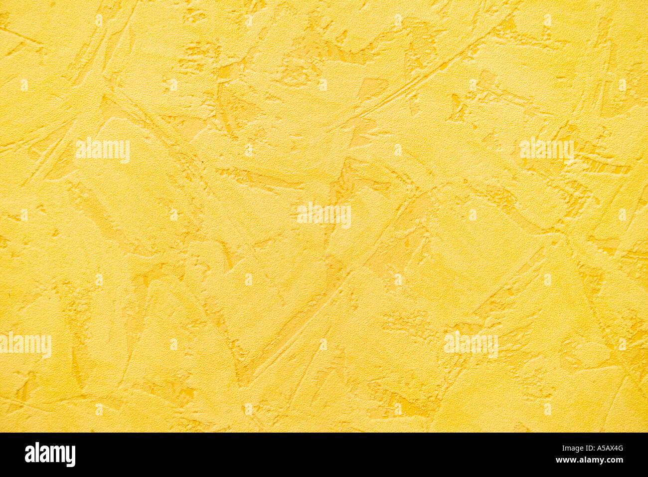 Texture shot of a structured yellow wall Stock Photo - Alamy