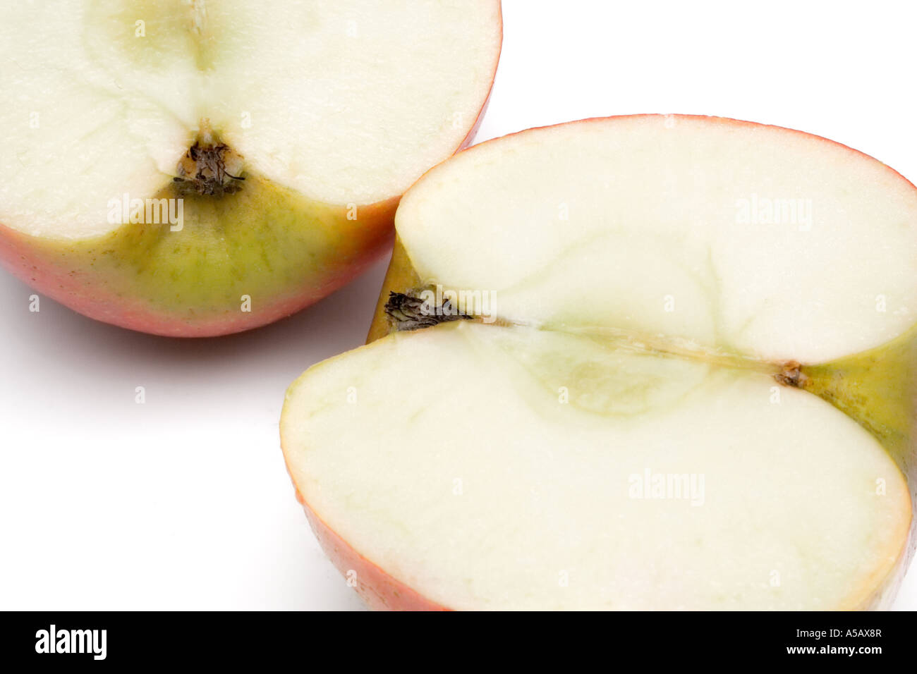 Two halves of an apple isolated on a white background Stock Photo - Alamy