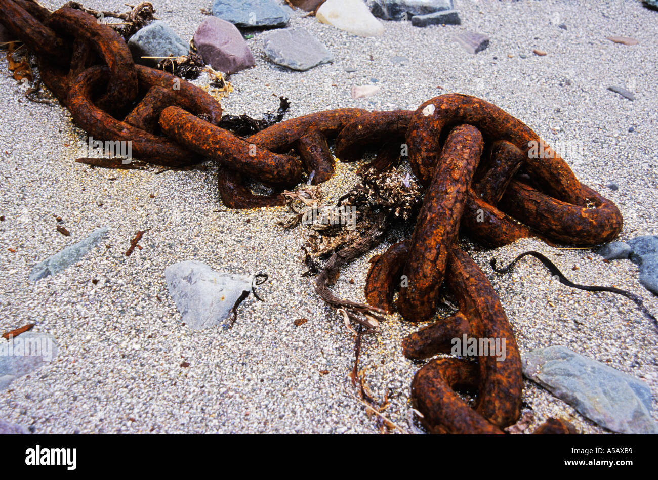 Rusty chain on sandy beach Stock Photo - Alamy