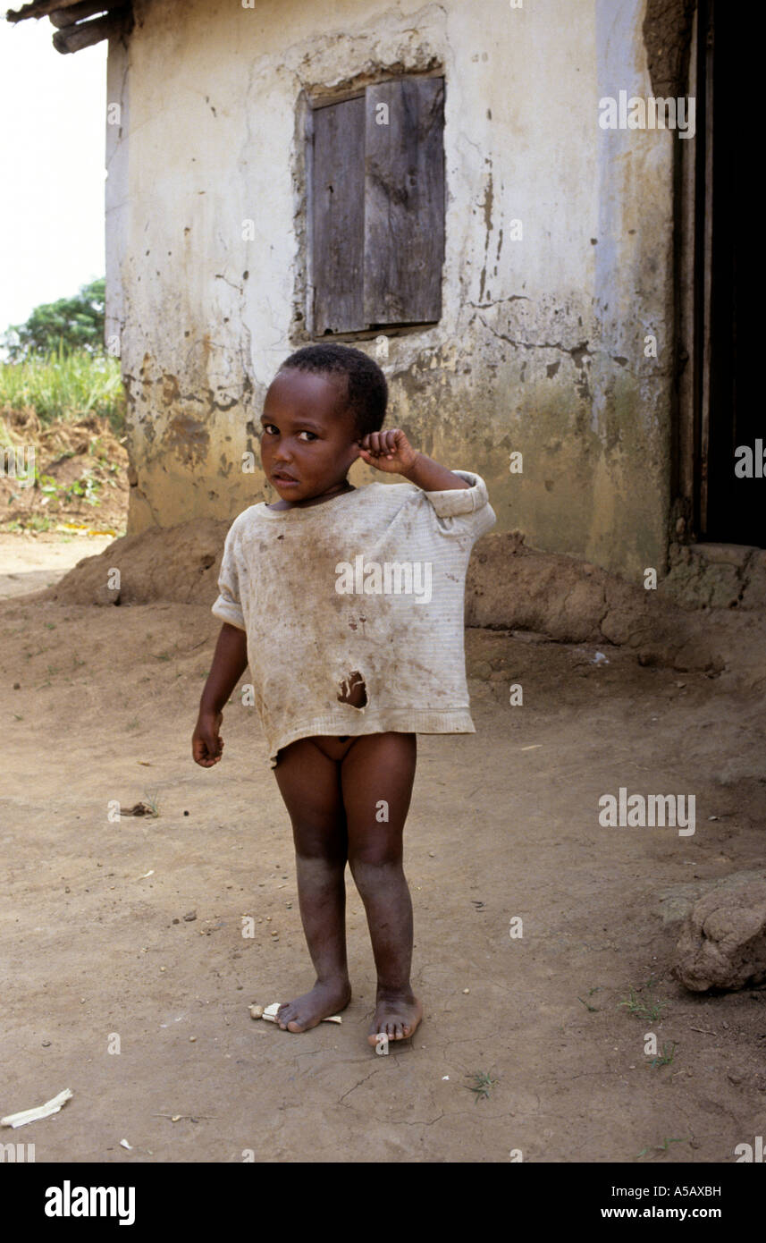 young child standing alone outside mud hut, Uganda, Africa Stock Photo ...