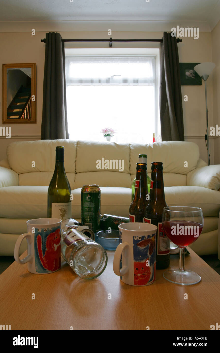 Closeup of a British living room coffee table with empty beer cans and ...