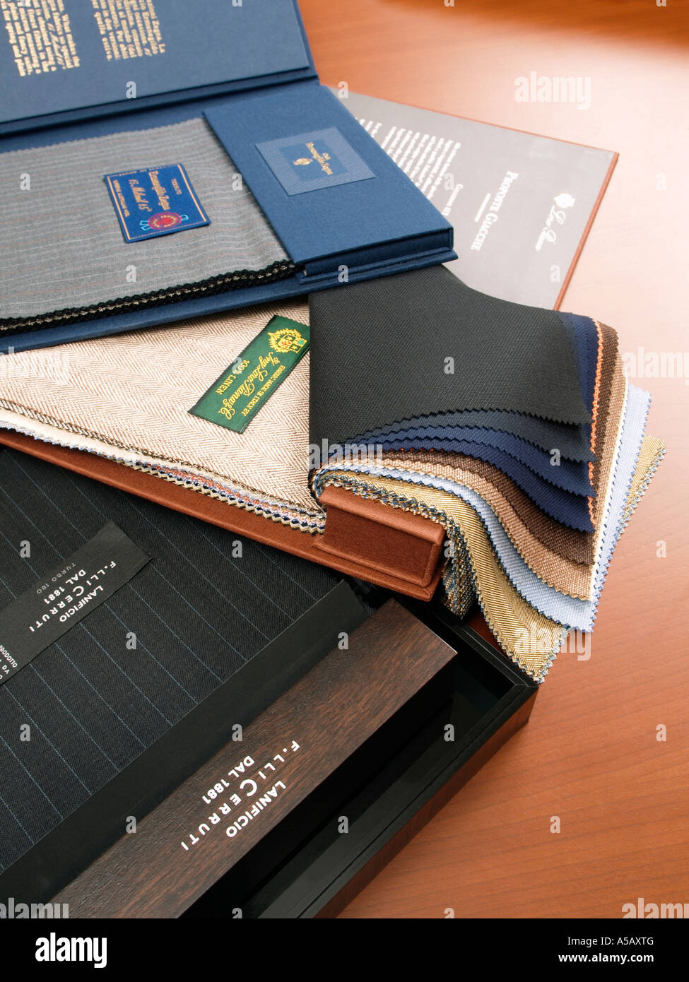 Cloth swatches and samples as used by a tailor to design a custom made ...