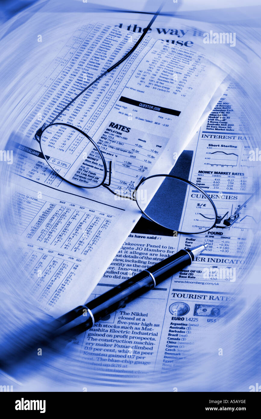 Financial newspaper pen and glasses Stock Photo - Alamy