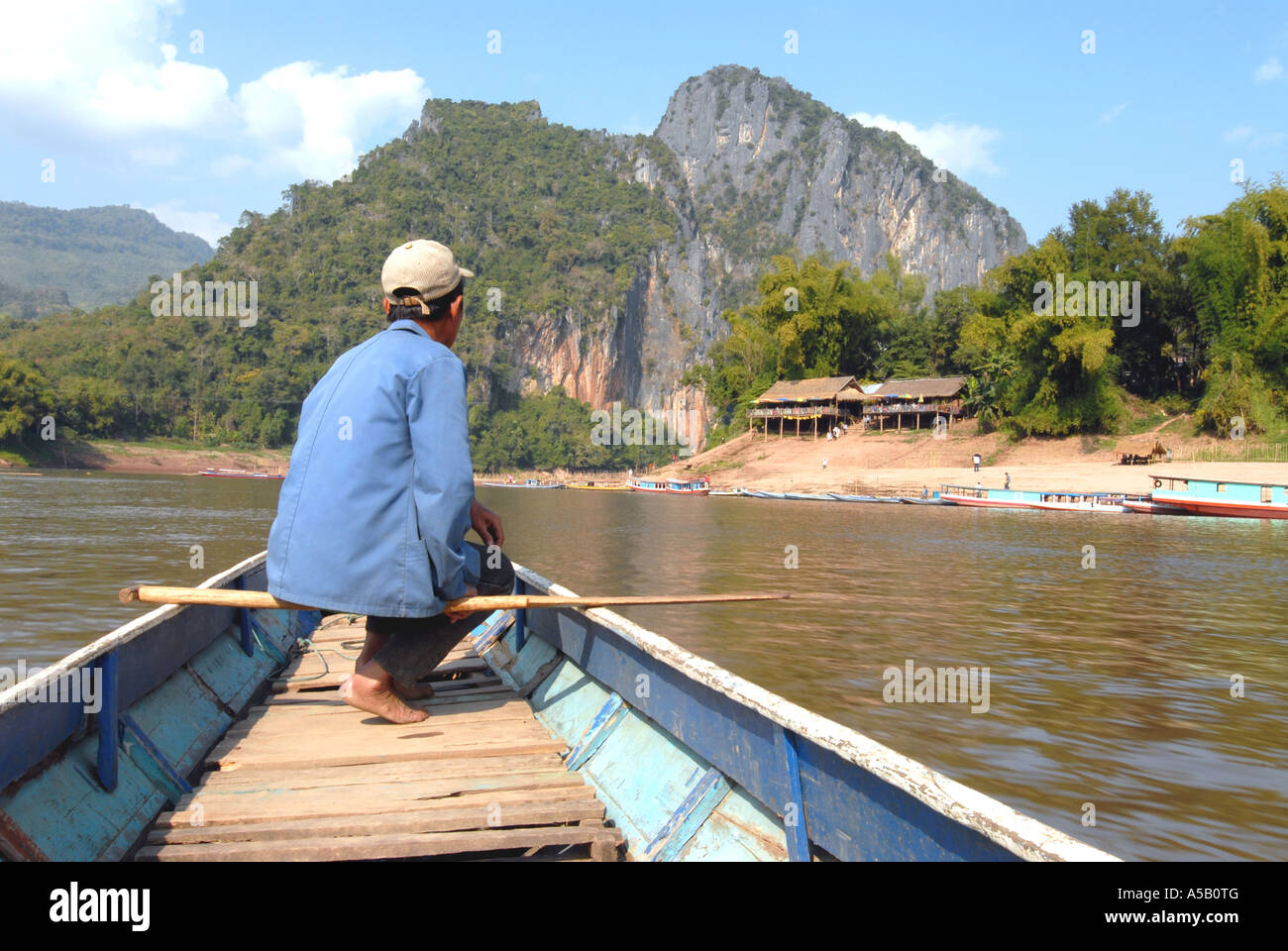 Boatman on Mekong River in Laos Stock Photo - Alamy