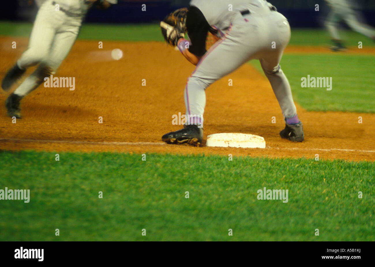 USA New York City Baseball game stadium. Runner tries to reach base ...