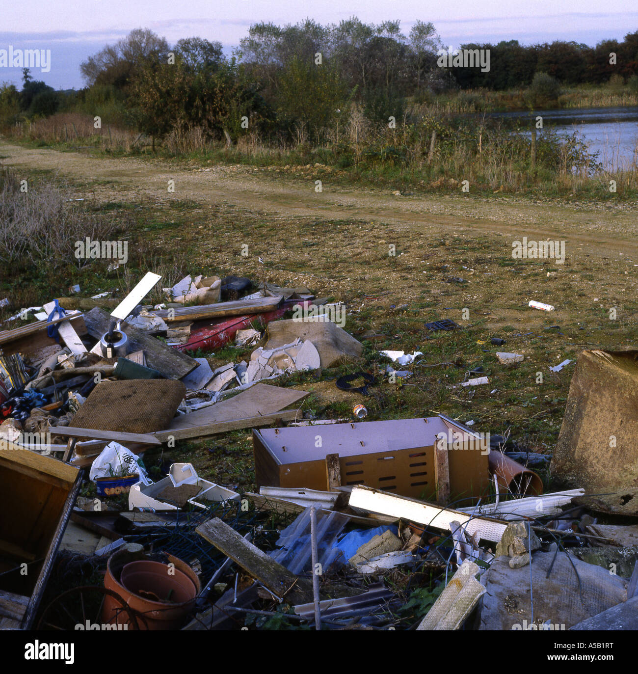 Dumped rubbish by lakeside in Oxfordshire England Stock Photo - Alamy