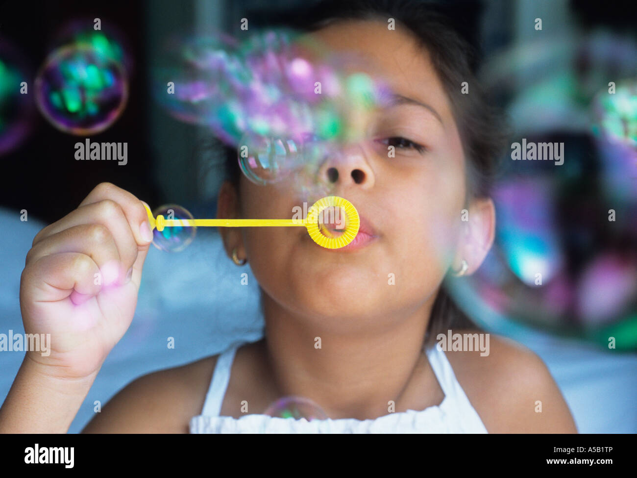 Young Child Blowing Bubbles USA Stock Photo - Alamy