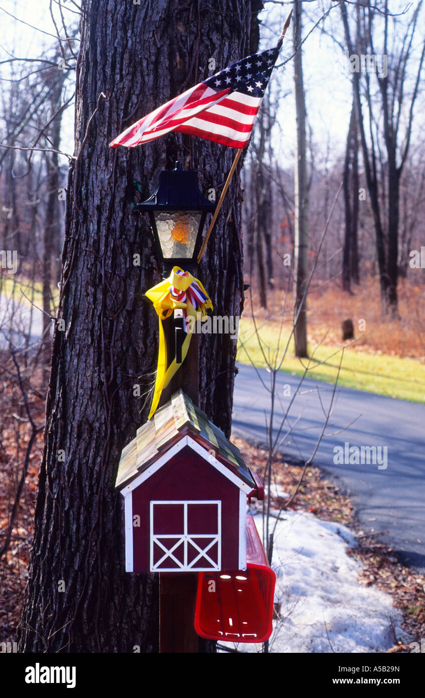 Mailbox with American flag and a yellow ribbon tribute. Rural country ...