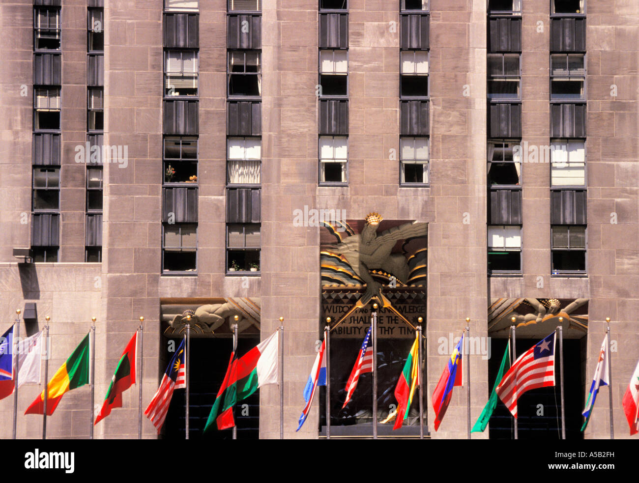 Comcast Building in Rockefeller Center and international flags. New ...