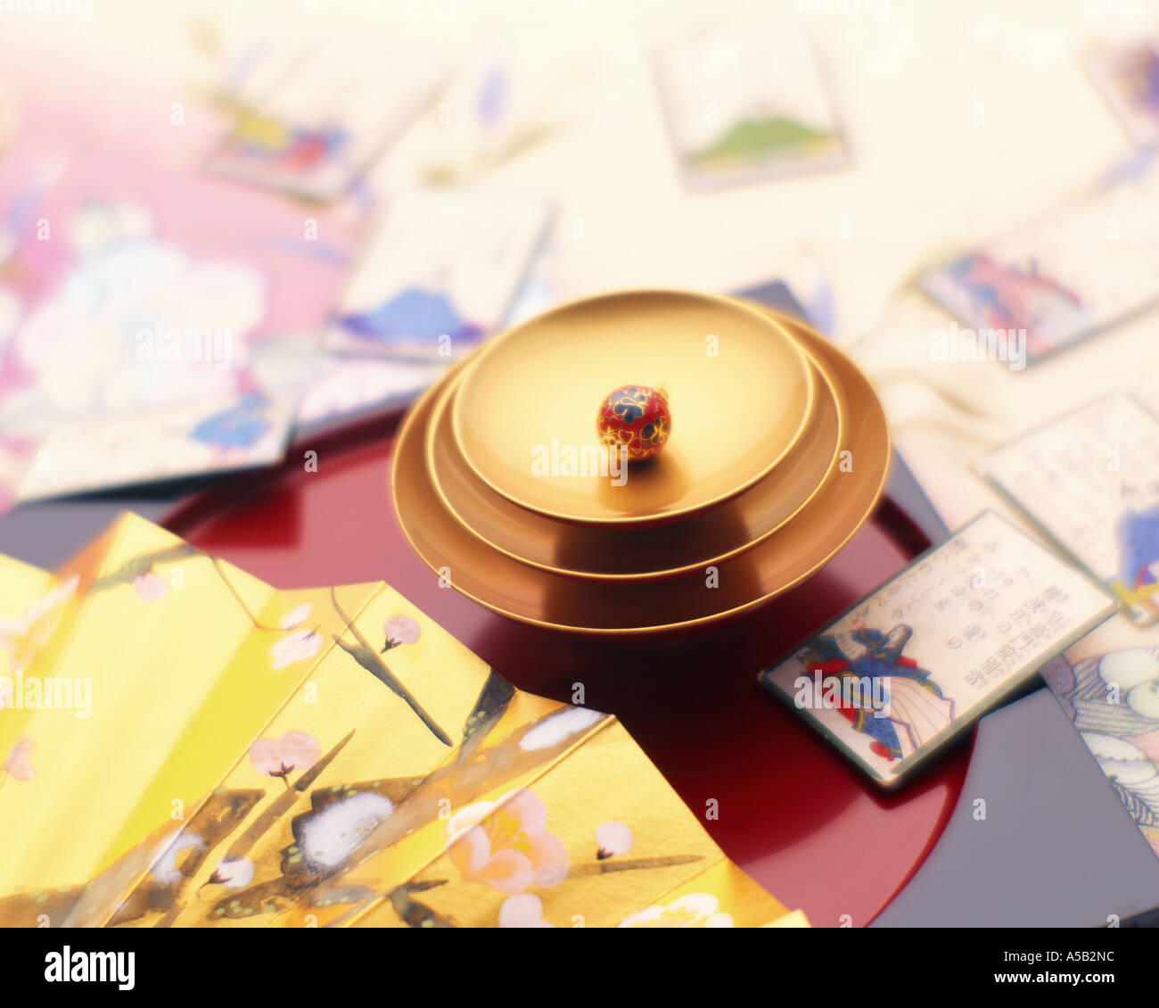 Folding fan and sake cups Stock Photo - Alamy