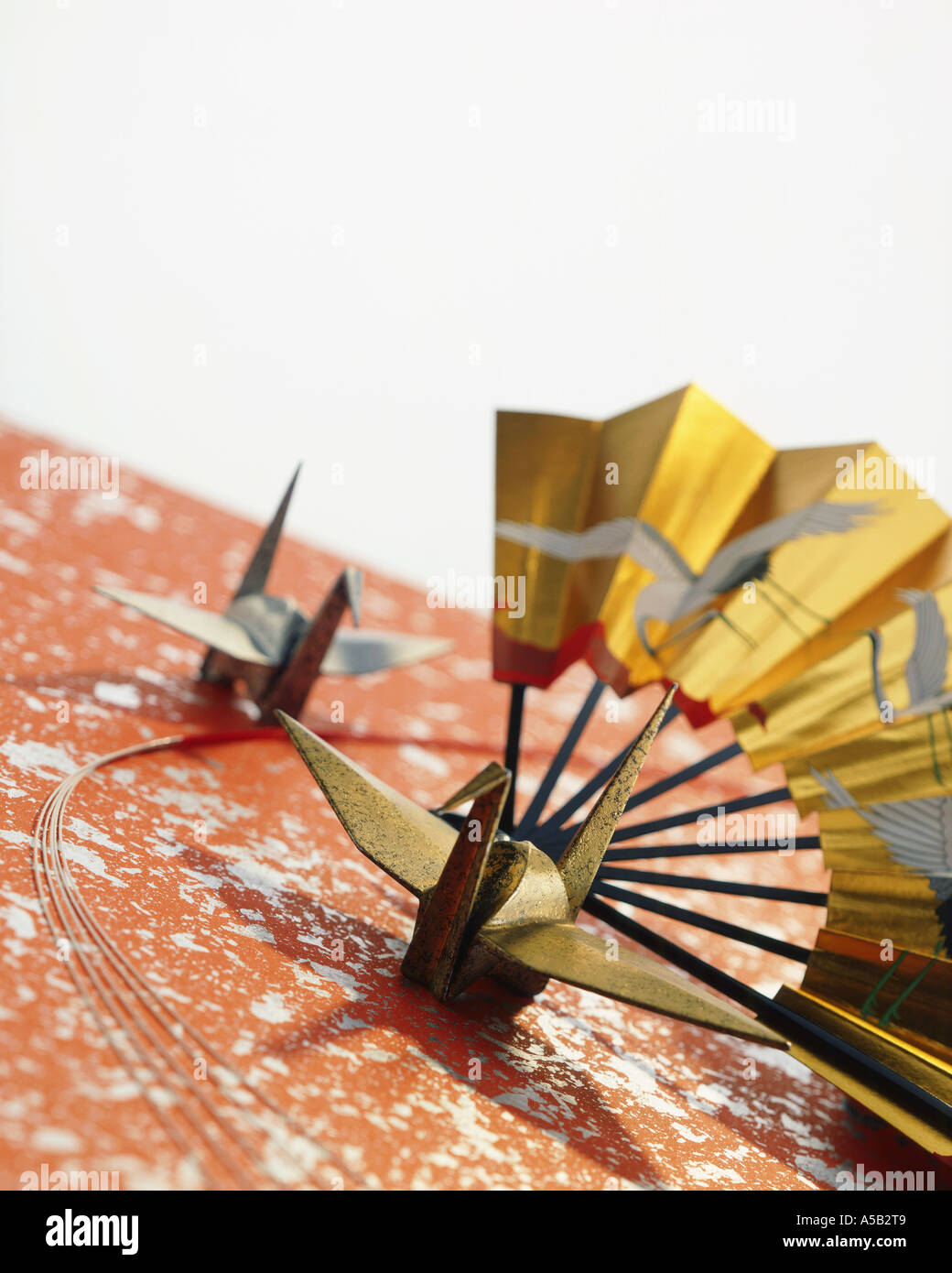 Folding fan and origami cranes Stock Photo - Alamy