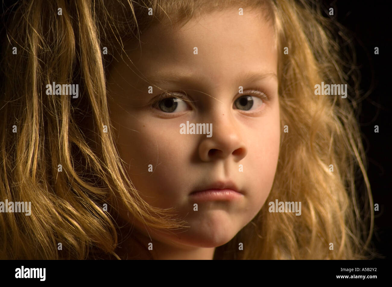 Five year old scowling Stock Photo - Alamy